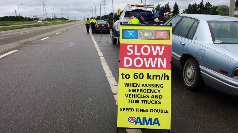 Slow Down or Move Over When Passing Tow Trucks | AMA